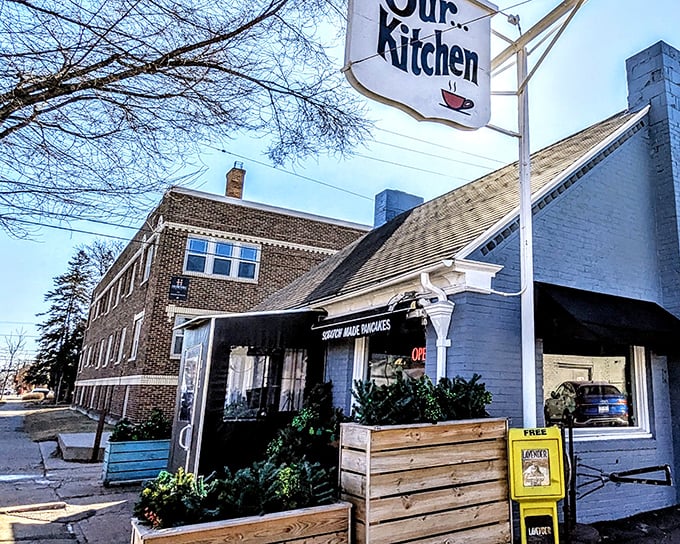 The iconic Our Kitchen sign beckons like a lighthouse for breakfast sailors. This unassuming white brick building houses Minneapolis breakfast magic.