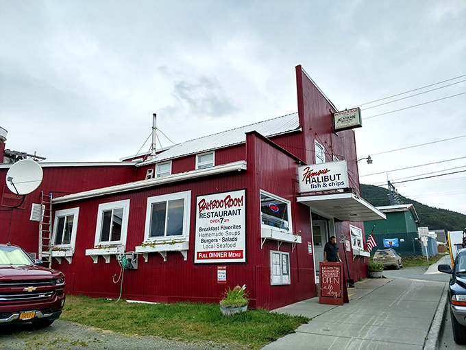 The crimson-colored Bamboo Room stands like a culinary lighthouse in Haines, its weathered exterior promising authentic Alaskan flavors within those humble walls.