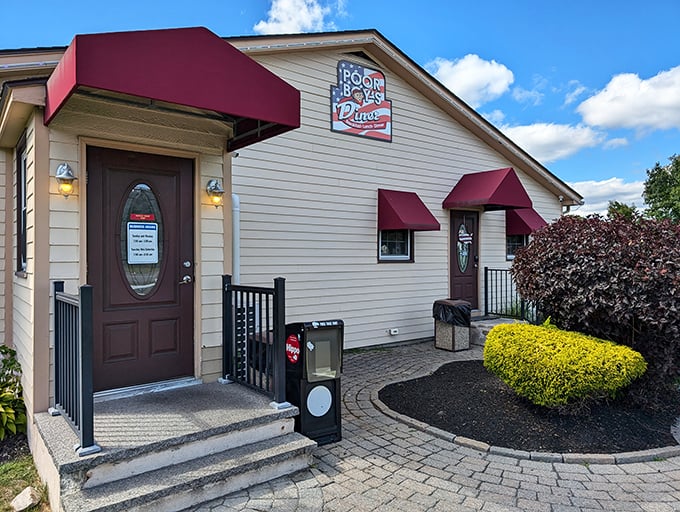 The unassuming exterior of Poor Boy's Diner hides culinary treasures within, like finding a winning lottery ticket in your winter coat pocket.