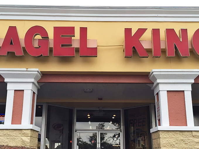 The bold red letters of Bagel King stand out against the yellow facade like a beacon calling all breakfast enthusiasts to their carbohydrate destiny.