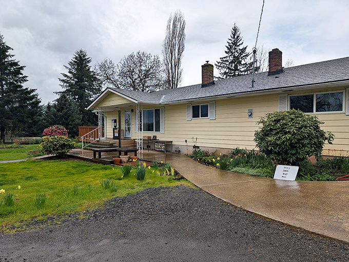 The unassuming yellow ranch house that houses The Pie Guy sits nestled among towering evergreens, with spring daffodils dotting the lawn &ndash; proof that culinary treasures often hide in plain sight.