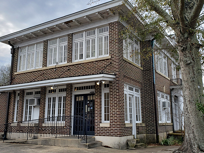 Two-story Southern charm in brick and mortar. The Dinner Bell's architectural details speak of a time when buildings, like meals, were crafted to last generations.