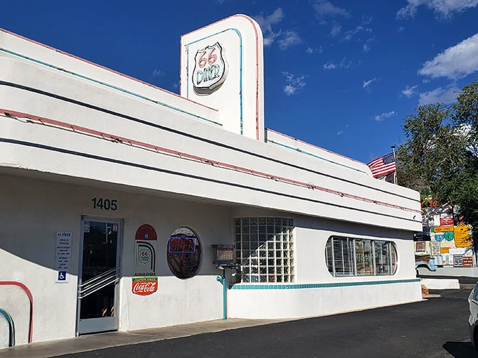 The gleaming white exterior of 66 Diner stands as a beacon of nostalgia on Albuquerque's stretch of historic Route 66, promising delicious adventures within.