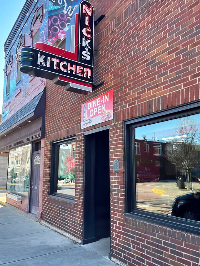 That vintage neon sign isn't just advertising; it's a beacon calling tenderloin pilgrims home to downtown Huntington.