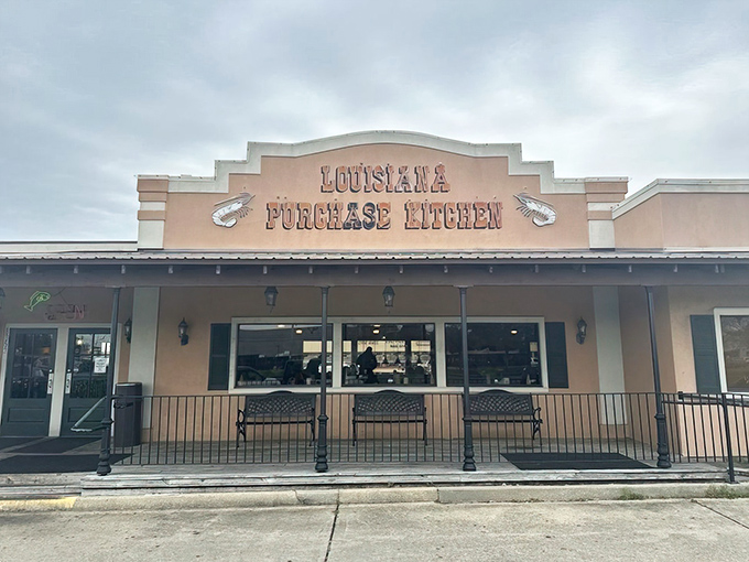 The peach-colored facade of Louisiana Purchase Kitchen stands like a culinary lighthouse, beckoning hungry travelers with promises of authentic Creole goodness.