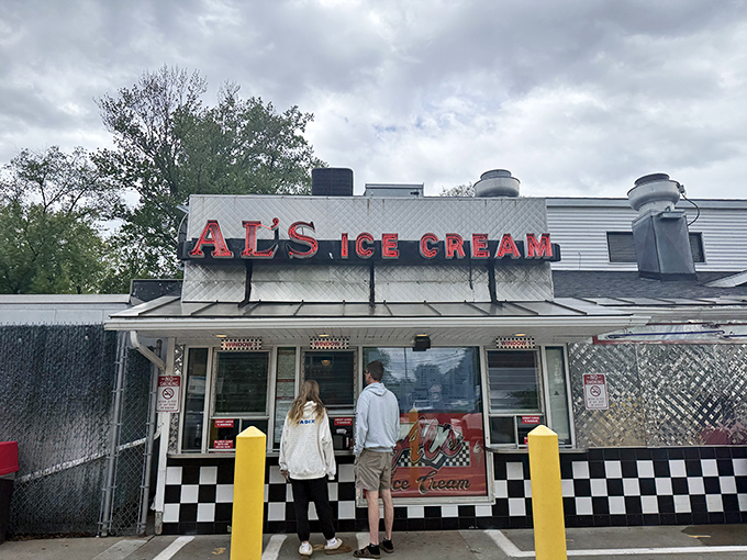 The iconic Al's Ice Cream sign beckons like a neon lighthouse, guiding hungry travelers to this South Burlington landmark where time stands deliciously still.