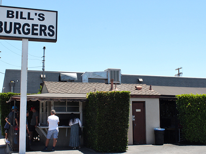 The unassuming exterior of Bill's Burgers stands like a time capsule against the Sherman Oaks sky, promising burger perfection without any fancy frills.