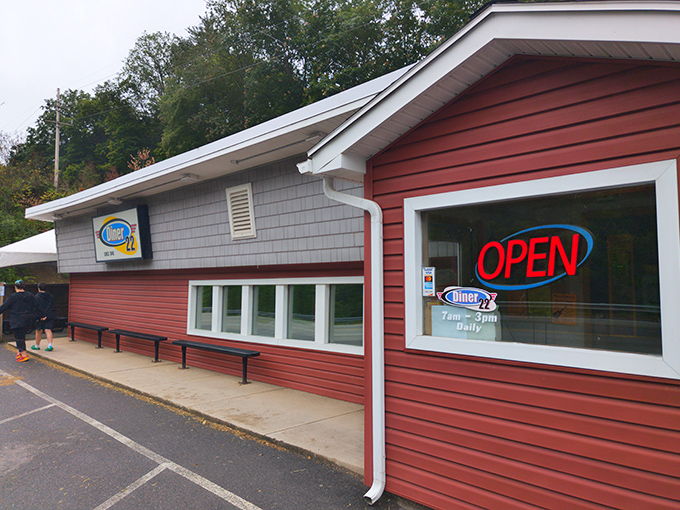 The classic red exterior of Diner 22 stands as a beacon of comfort along Route 22, promising homestyle meals and conversations that matter.