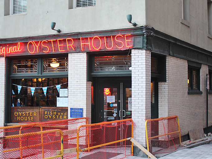 The iconic neon sign of the Original Oyster House glows like a maritime beacon in Pittsburgh's Market Square, welcoming seafood lovers for generations.