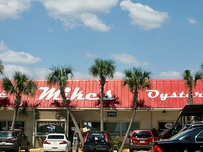 As evening approaches, Mike's yellow facade glows with promise beneath its signature red roof, while palm trees stand guard over a parking lot that's rarely empty.