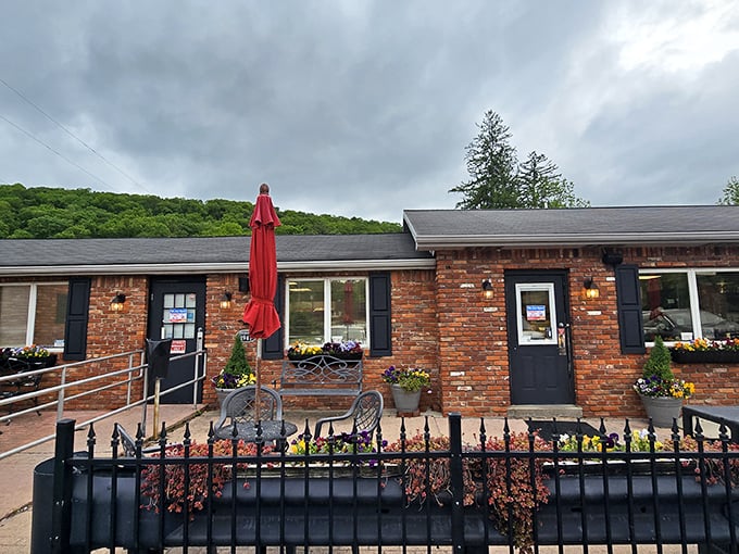 The humble brick exterior of The Pie Shoppe belies the magic happening inside. Those red umbrellas aren't just for show&mdash;they're recovery zones for pie-induced euphoria.