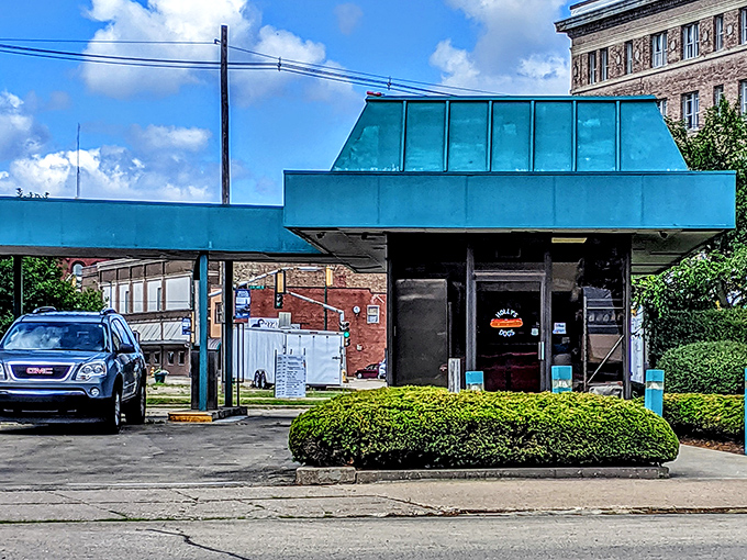 The little blue building that could! Holly's Dogs' retro drive-thru in Clinton proves the best culinary treasures often hide in plain sight.