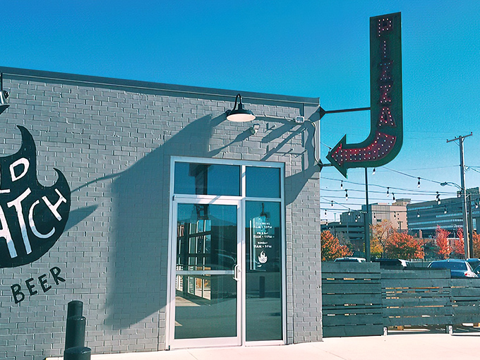 That retro-cool arrow sign points the way to pizza nirvana, standing out against Dayton's blue sky like a neon promise of deliciousness to come.