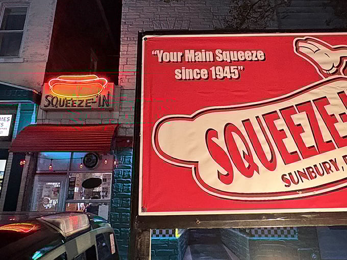 The neon hot dog sign glows like a beacon of hope for hungry travelers. This tiny storefront on Market Street has been Sunbury's "Main Squeeze" since 1945.