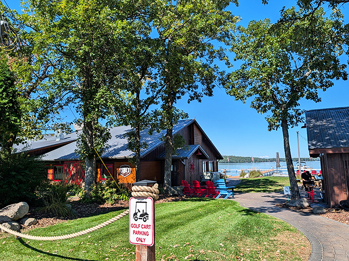 Where Minnesota lake life meets culinary comfort &ndash; Ernie's nestled among towering trees with Gull Lake sparkling beyond.