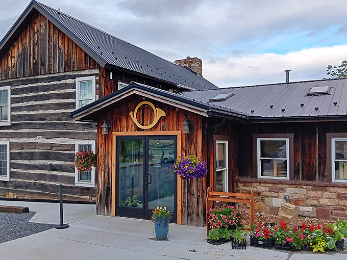The rustic charm of Horn O' Plenty's exterior welcomes you like an old friend, complete with hanging flower baskets that add splashes of color to the weathered wood.