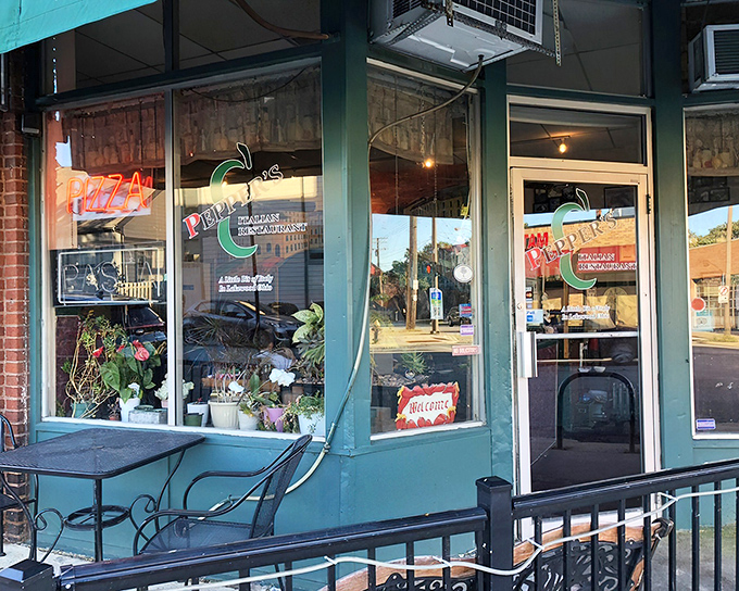 The unassuming green storefront of Pepper's beckons with neon pizza signs and a "Welcome" that feels like your Italian grandmother's embrace.