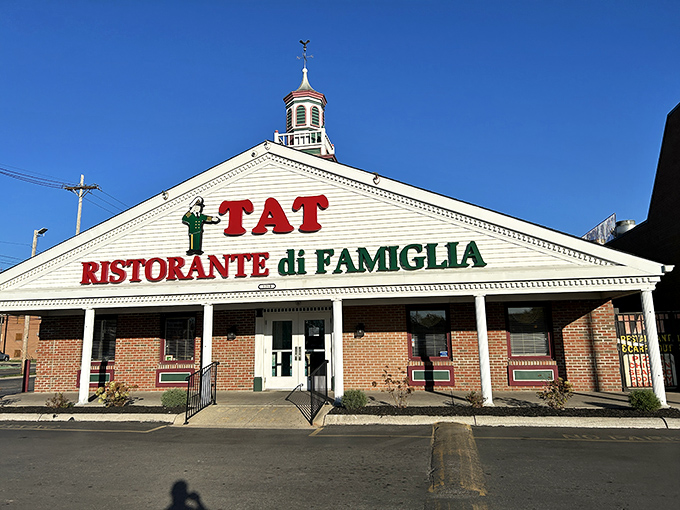 The iconic white building with its distinctive cupola and bold red lettering stands as a Columbus landmark. TAT's exterior promises Italian-American comfort before you even step inside.