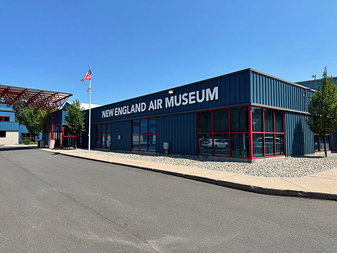 The unassuming blue exterior of the New England Air Museum belies the aviation wonderland waiting inside. Like finding a five-star restaurant in a strip mall.