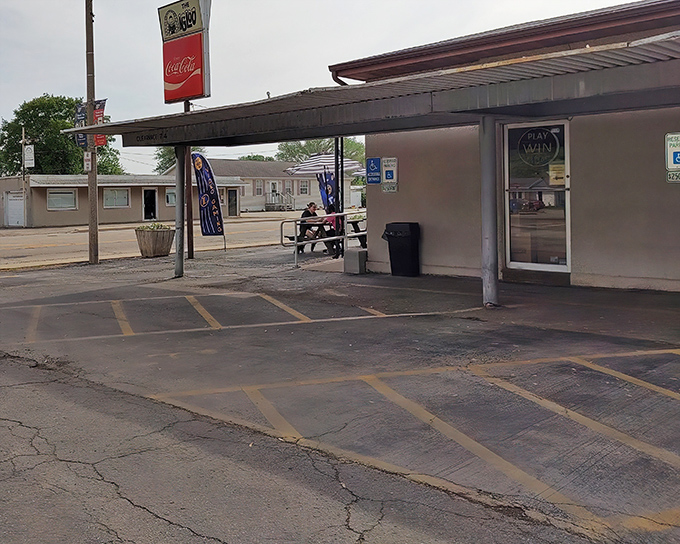 The unassuming exterior of The Igloo Diner in Peru, Illinois, where culinary magic happens without fanfare. Like finding a winning lottery ticket in your winter coat pocket.