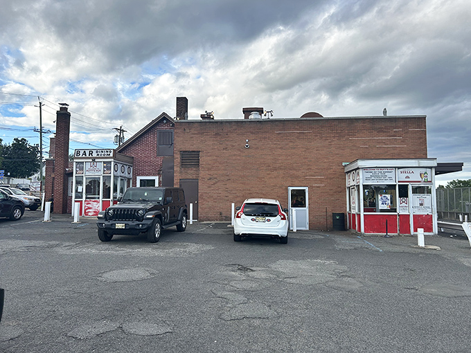 The unassuming brick exterior of Rutt's Hut stands like a time capsule from another era, its iconic sign beckoning hungry pilgrims to New Jersey's hot dog mecca.