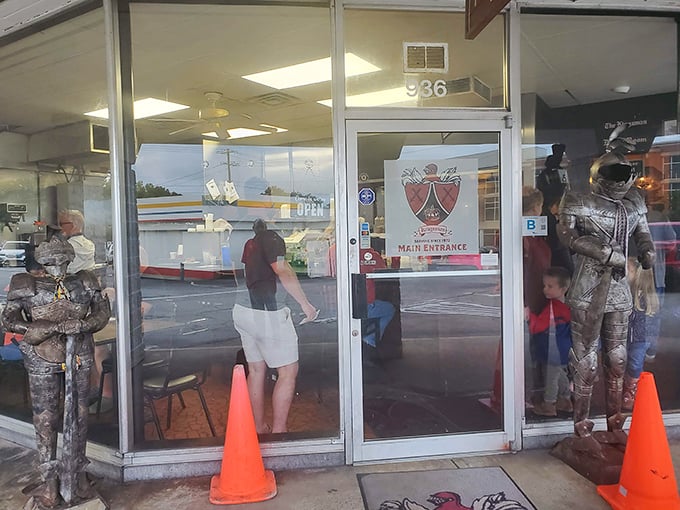 Knight statues stand guard outside Kingsman Restaurant, promising a royal feast within these humble walls. Medieval meets Main Street in the most delicious way possible.