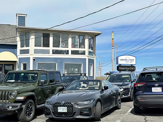 The blue clapboard exterior of Lobster Cove stands like a delicious mirage against the Maine coastline, promising seafood nirvana within.