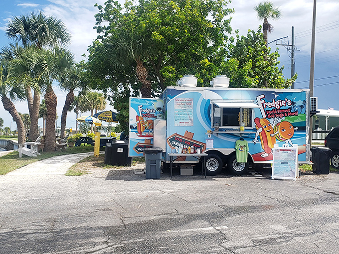 Paradise found: palm trees, blue skies, and a hot dog stand that looks like it was plucked straight from a Jimmy Buffett daydream.