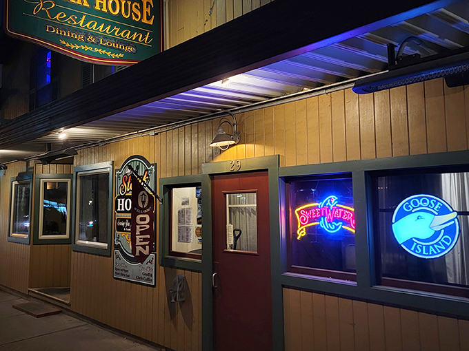 At night, the neon beer signs cast a welcoming blue glow that says, "Yes, we have cold beer to accompany that perfect steak you're about to devour."