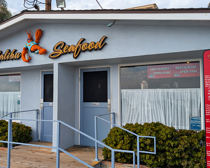 The blue facade of Malibu Seafood with its cheerful lobster sign promises seafood paradise without pretension—California coastal dining at its most authentic.