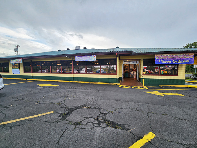 The unassuming yellow and green exterior of Ken's House of Pancakes stands like a beacon of comfort food hope on Hilo's Kamehameha Avenue.