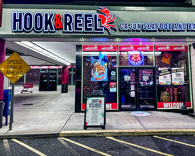 The neon glow of Hook & Reel beckons like a lighthouse for the seafood-starved, promising Cajun treasures within those unassuming strip mall walls.