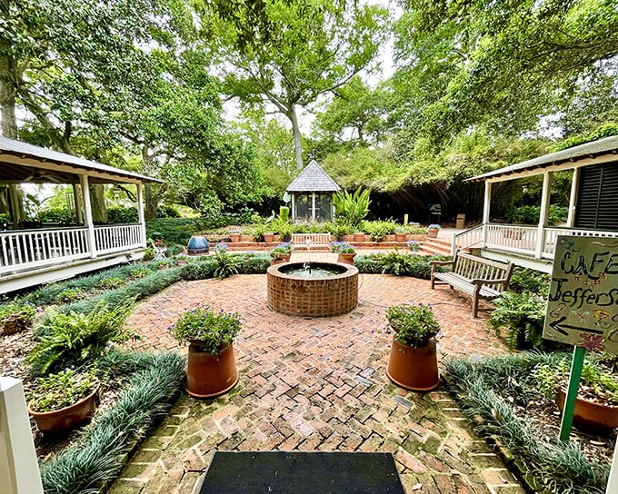 A brick courtyard paradise where time stands still. The central fountain whispers secrets while benches invite you to sit and forget your to-do list entirely.