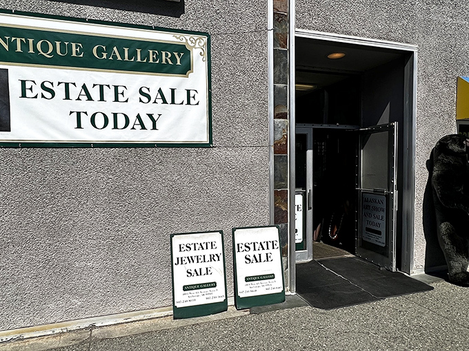 The unassuming entrance to Anchorage's time portal. Estate sale signs beckon like sirens, promising treasures within this concrete Narnia.