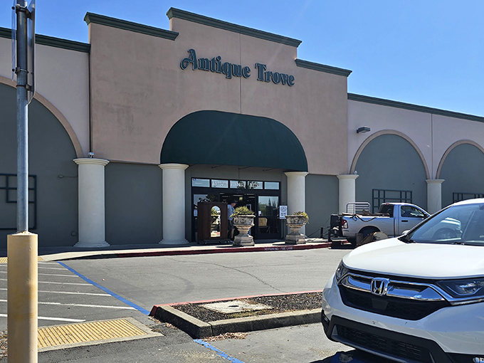 The unassuming facade of Antique Trove belies the wonderland of treasures waiting inside. Like a time machine disguised as a strip mall tenant.