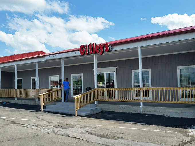 The unassuming exterior of Gilley's hides a universe of treasures within, like finding a portal to the past disguised as a simple country building.