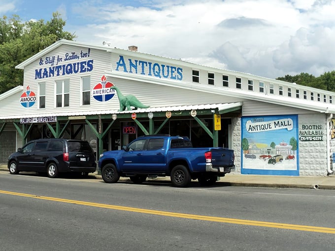 The unassuming exterior of Mantiques Antiques in Hazel, with its vintage Amoco signs and dinosaur guardian, promises treasures that the modest fa&ccedil;ade can't possibly contain.