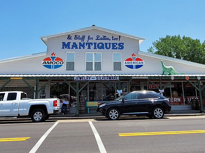 The unassuming exterior of Mantiques Antiques in Hazel, with its vintage Amoco signs and dinosaur guardian, promises treasures that the modest fa&ccedil;ade can't possibly contain.