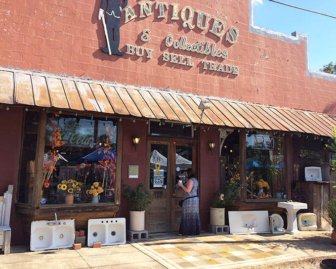 The brick facade of CJ's welcomes treasure hunters with vintage sinks standing guard outside &ndash; a hint at the practical treasures waiting within.
