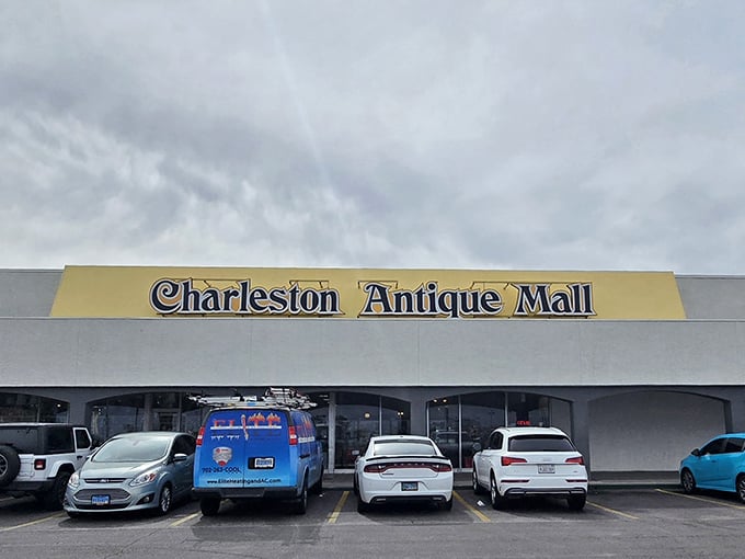 The unassuming exterior of Charleston Antique Mall belies the treasure trove within – like finding a portal to the past behind a modest storefront.