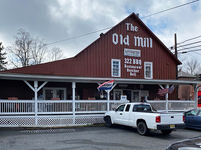 The Old Mill's distinctive red barn exterior beckons treasure hunters like a siren song of nostalgia.