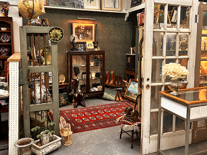 A perfectly curated vignette where cowboy boots meet vintage china &ndash; like someone's fascinating grandmother designed a movie set.