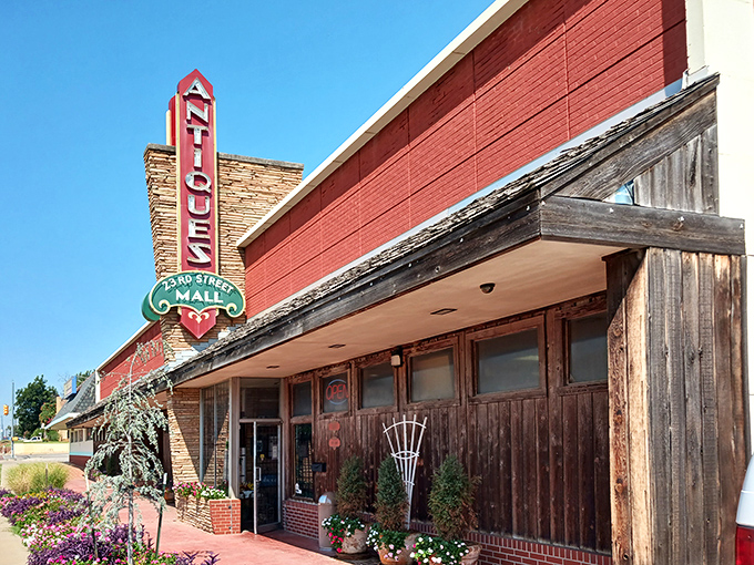 The iconic vintage sign of 23rd Street Antique Mall stands tall against the Oklahoma sky, beckoning treasure hunters like a retro lighthouse for nostalgia seekers.