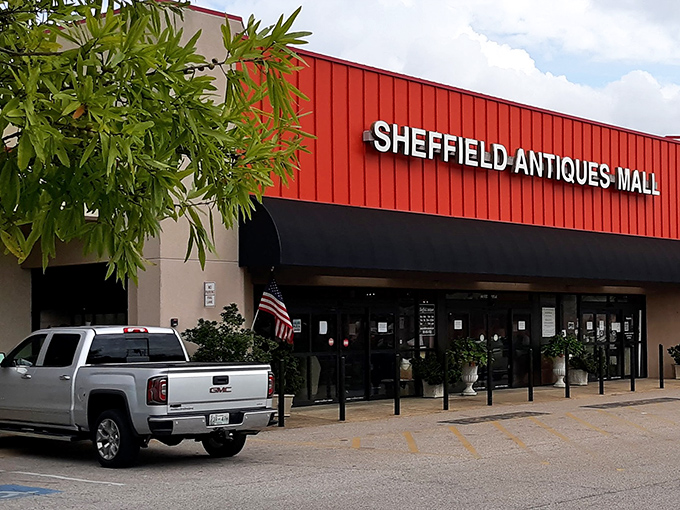 The iconic red roof of Sheffield Antiques Mall beckons treasure hunters like a lighthouse for vintage enthusiasts navigating the sea of mass-produced sameness.