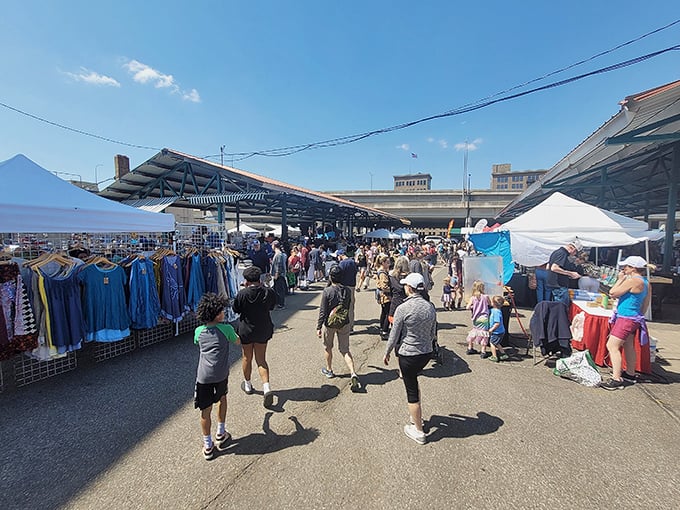 Shoppers navigate the market's covered walkways like food explorers on a mission. The quest for the perfect tomato is serious business!