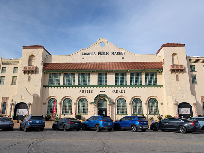The Spanish Colonial Revival fa&ccedil;ade of OKC Farmers Public Market stands as a timeless sentinel, welcoming visitors with architectural grace that whispers of Oklahoma's vibrant past.