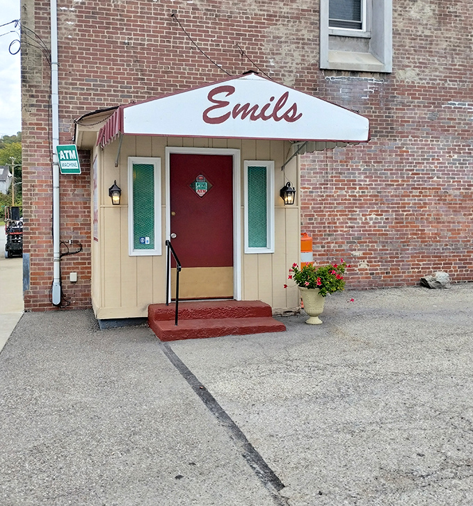 The unassuming entrance to Emil's Lounge stands like a culinary speakeasy, its modest awning and red door hiding one of Pennsylvania's greatest sandwich treasures.