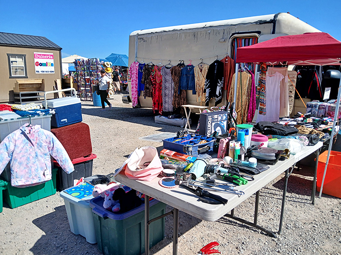The treasure hunter's paradise awaits! Tables laden with shoes, clothes, and knick-knacks stretch toward the horizon under Yuma's brilliant blue sky.