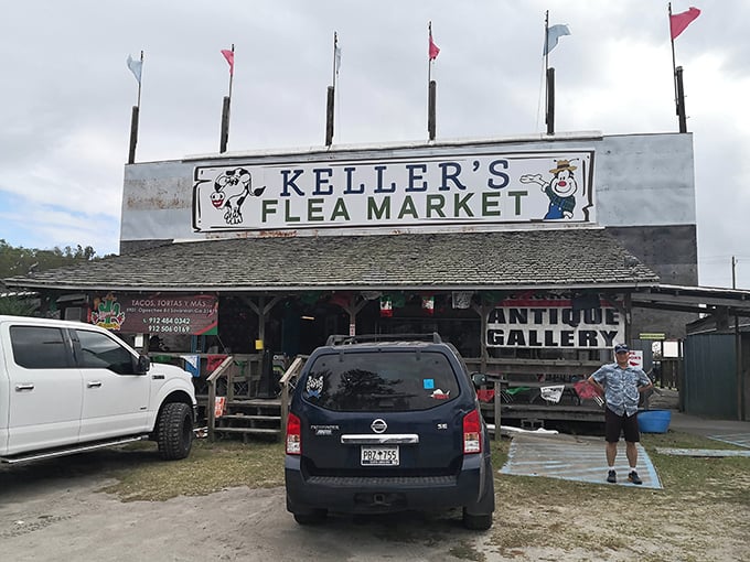 The iconic entrance to Keller's Flea Market stands like a beacon for treasure hunters, complete with colorful flags announcing your arrival at bargain paradise.