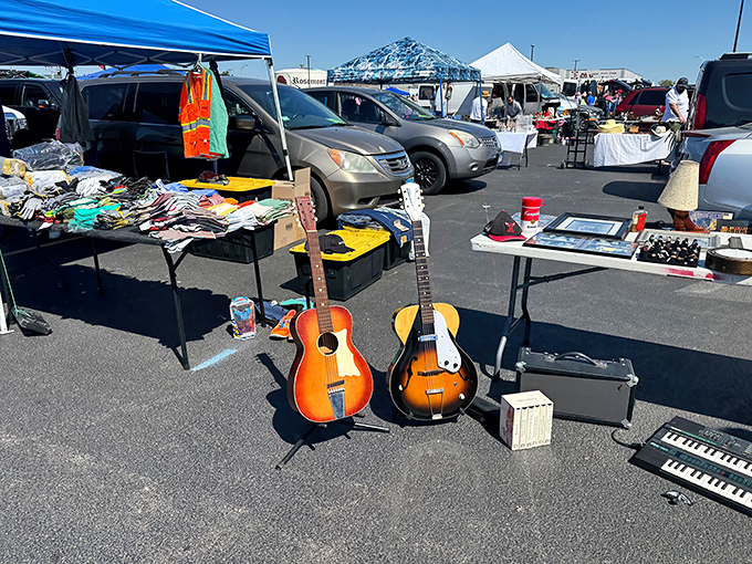 Musical treasures await! Vintage guitars stand ready for their second act while tables overflow with potential finds under the bright Rosemont sky.